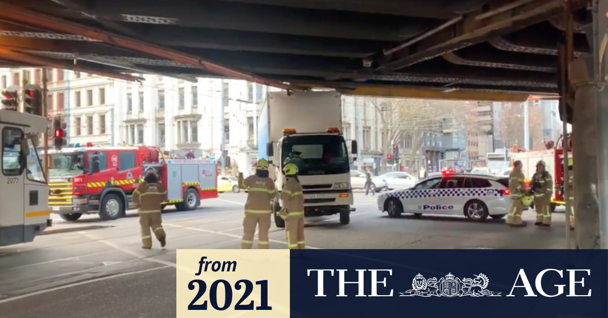 Commuter chaos after truck gets stuck under train bridge